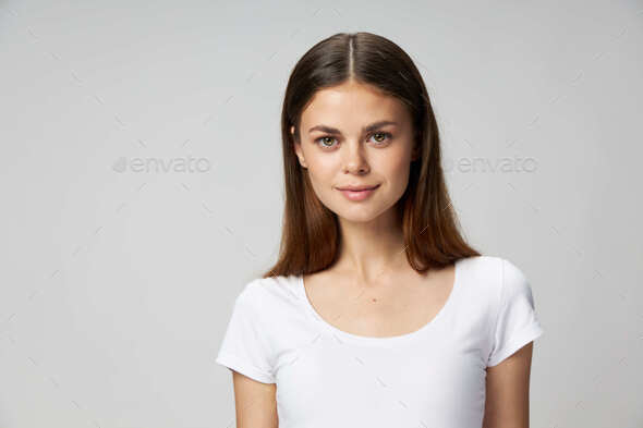 Pretty woman looking ahead smile cropped view white t-shirt Stock Photo ...