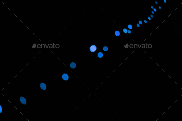 Bokeh, neon blue dots on black background and lights with pattern ...