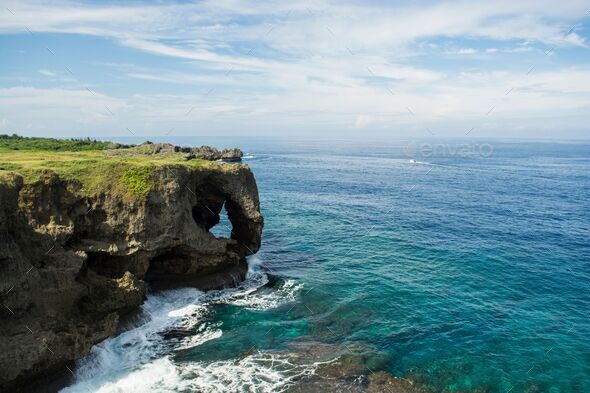 Scenic view of cliffs at the sea, Okinawa Prefecture, Japan Stock Photo ...