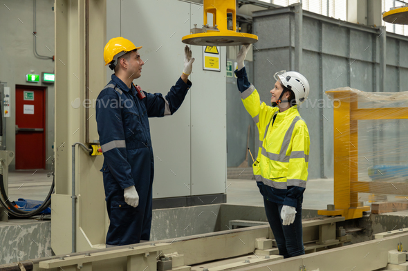 Two professional engineers check mechanical check undercarriage of ...