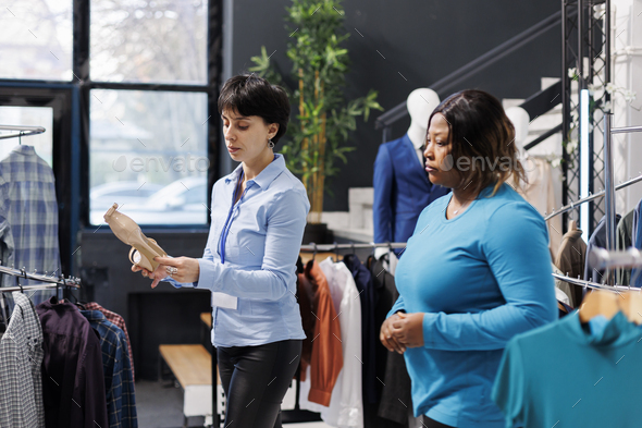Customer asking store employee for help Stock Photo by DC_Studio ...