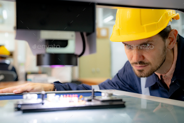 Technology Engineer Working in Factory. Engineer testing a robotic ...