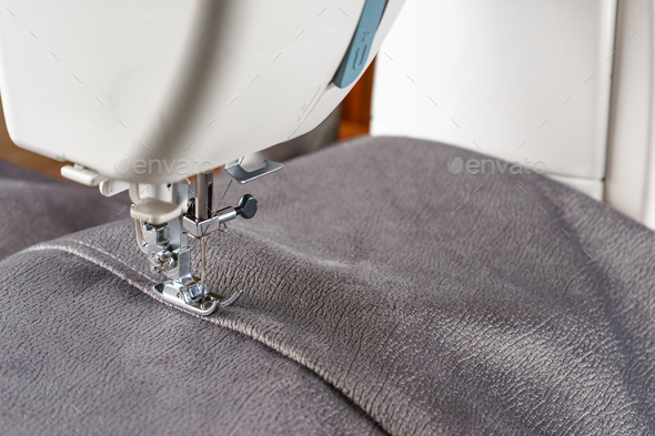 Modern Sewing Machine With Gray Velours Fabric Close Up Stock Photo by ...
