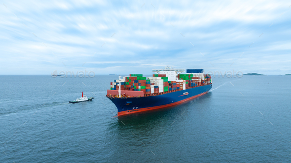 Aerial side view of cargo container ship carrying container from custom ...