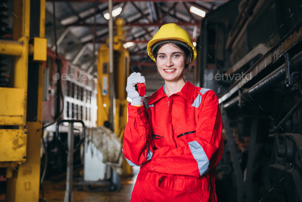 Portrait of Industrial engineers using walkie-talkie for check up ...