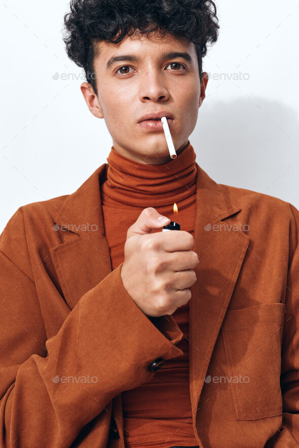 Man fashion sitting beige smoking cigarette portrait Stock Photo by ...