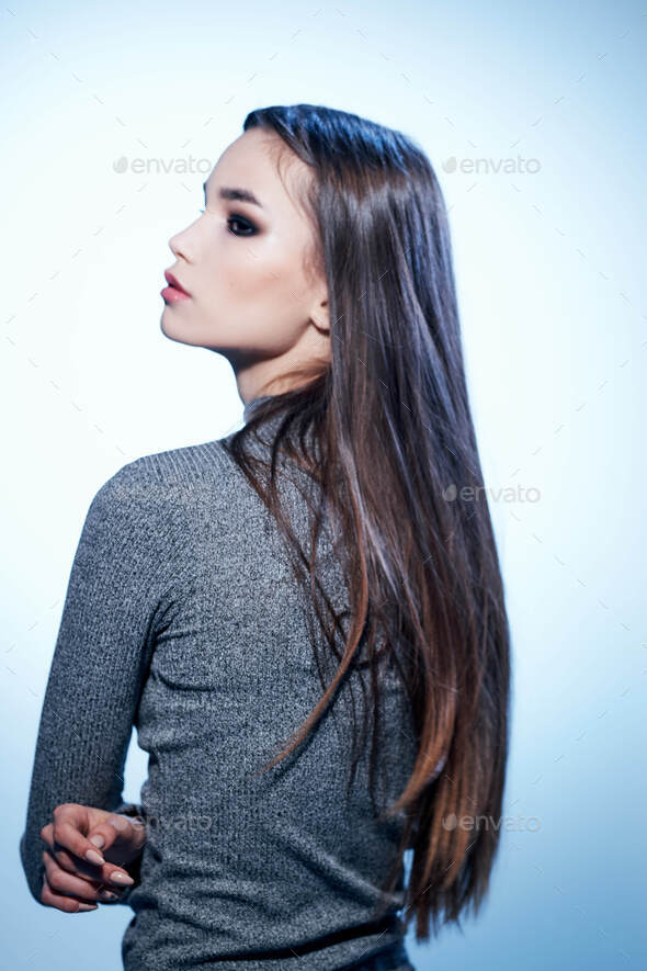 Woman in gray sweater hairstyle Model back view makeup Stock Photo by ...