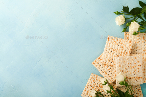 Passover celebration concept. Matzah, red kosher walnut and spring ...