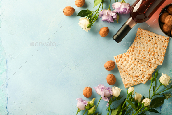 Passover celebration concept. Matzah, red kosher walnut and spring ...