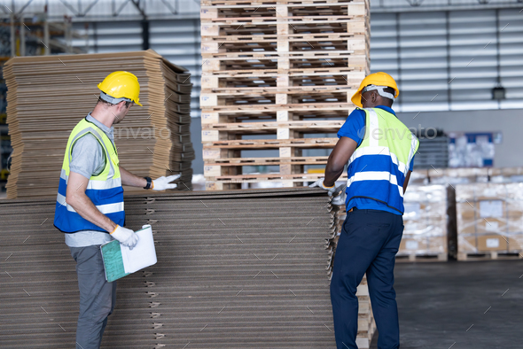 Warehouse staff verify automotive, paper items using handheld device ...