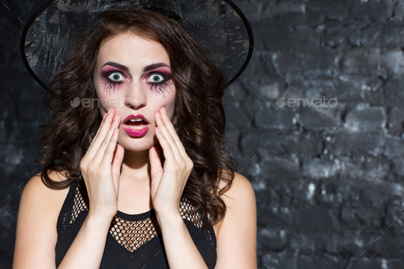 Shocked female witch looking at camera with open mouth. Stock Photo by ...