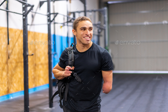 Man with one arm amputated arriving at the gym Stock Photo by Unai82