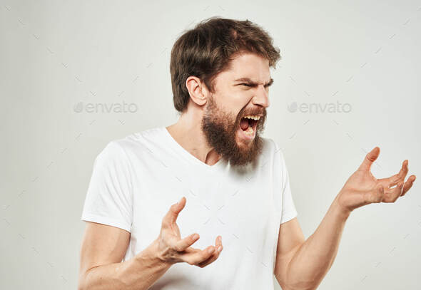 Aggressive man gestures with his hands thick beard irritability stress ...