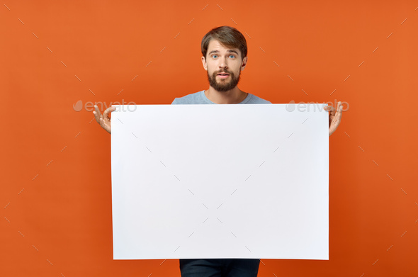 white sheet of paper ad advertisement man in the background orange ...