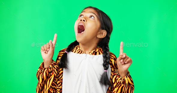 Shock, green screen and face of a child pointing isolated on a studio ...