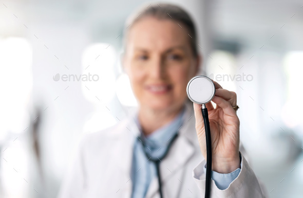 Senior woman, doctor and futuristic with stethoscope, smile and appointment with bokeh ...