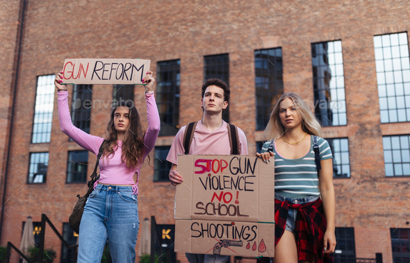 Generation Z activists with banners protesting on the street. Stock ...