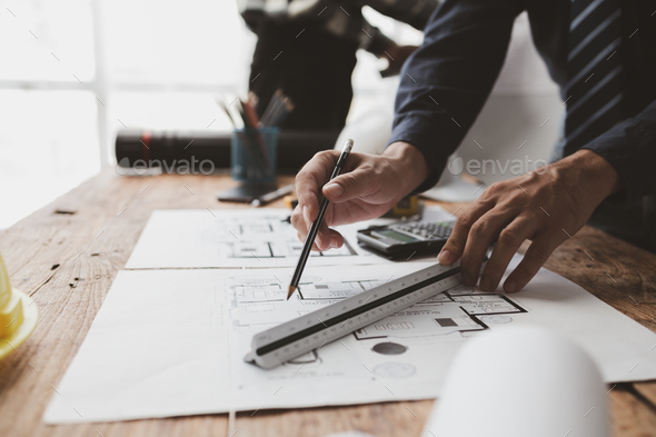 Architects design house plans for clients, drawing plans according to ...