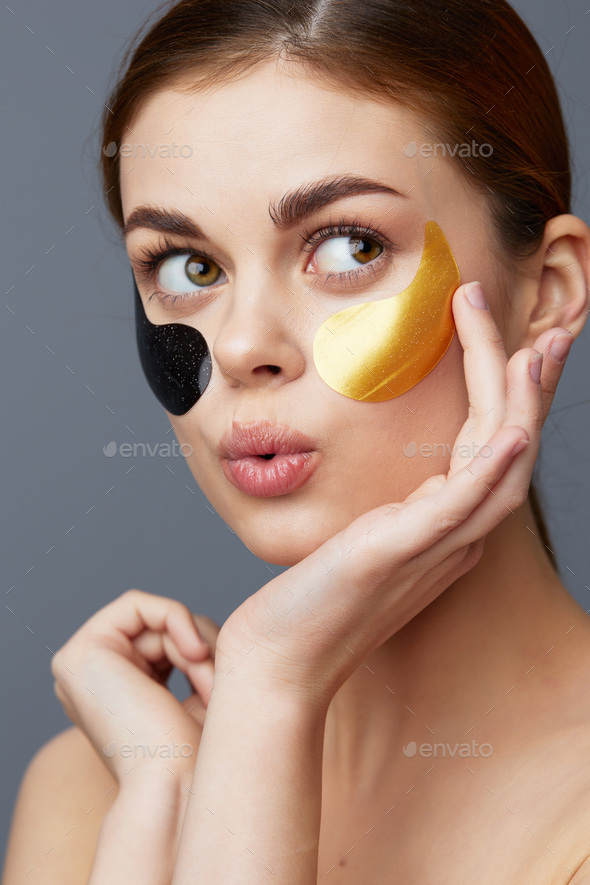 beautiful woman golden patches clean skin smile posing gray background ...