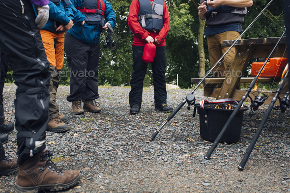 Group of people having fishing training Stock Photo by astrakanimages