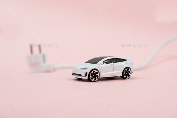 electric car charging battery hybrids concept on pink background Stock ...