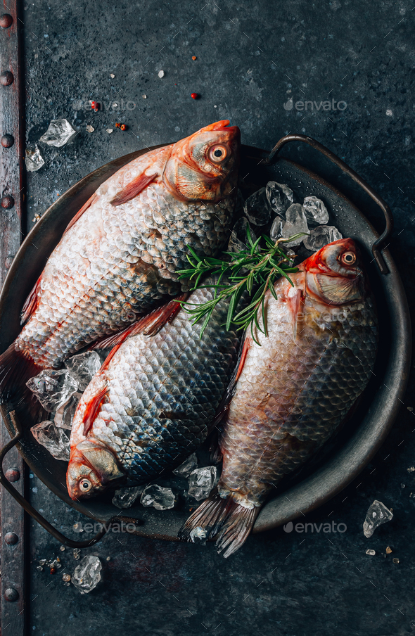 Rustic Fish Platter on galvanized backdrop Stock Photo by YMikhaylova