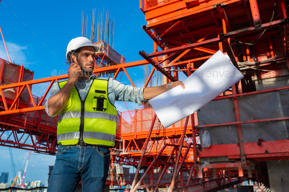 Portrait of an engineer designing a concrete floor and column structure ...