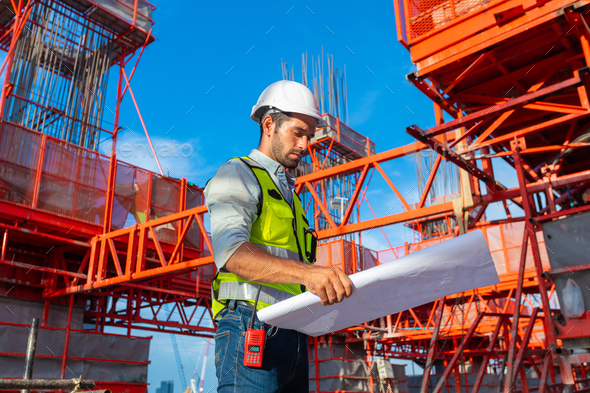 Portrait of an engineer designing a concrete floor and column structure ...