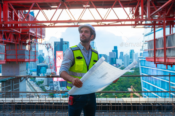 Portrait of an engineer designing a concrete floor and column structure ...