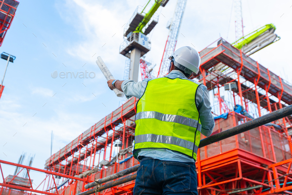 Portrait of an engineer designing a concrete floor and column structure ...