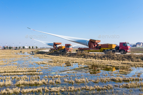 trucks transporting large wind turbine blades Stock Photo by chuyu2014