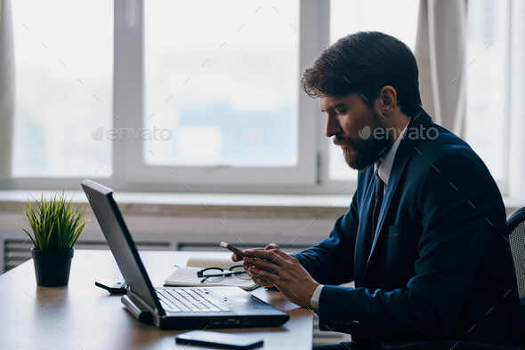 man in front of laptop working in front of laptop technologies success ...