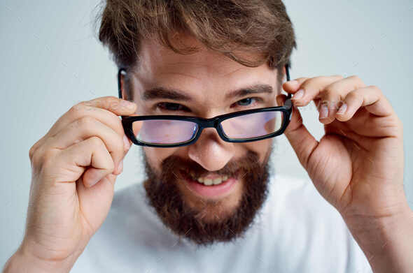 sick man vision problems in white t-shirt close-up Stock Photo by shotprime