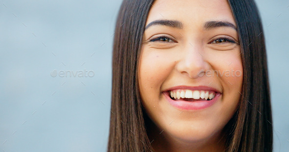 Closeup of laughing woman showing cheerful facial expression against ...