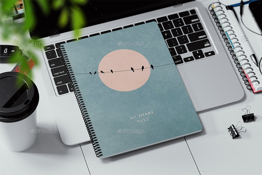 Coil Bound Book on a Laptop Keyboard Mockup, Graphics | GraphicRiver