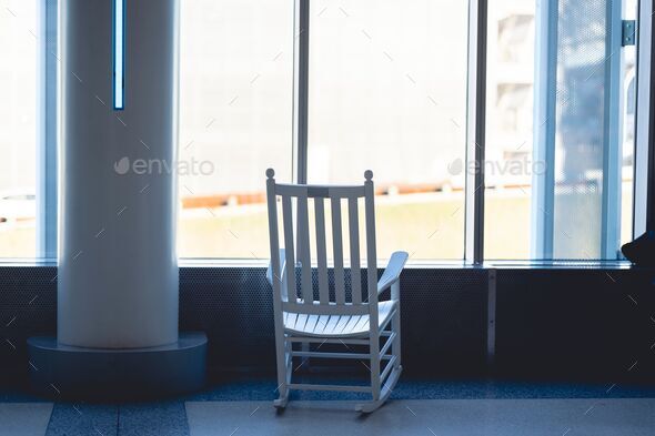 Back view of a white wooden rocking chair near a window Stock Photo by ...