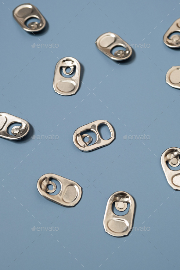 Ring pull tabs for open of drinking can. Stock Photo by zhenny-zhenny