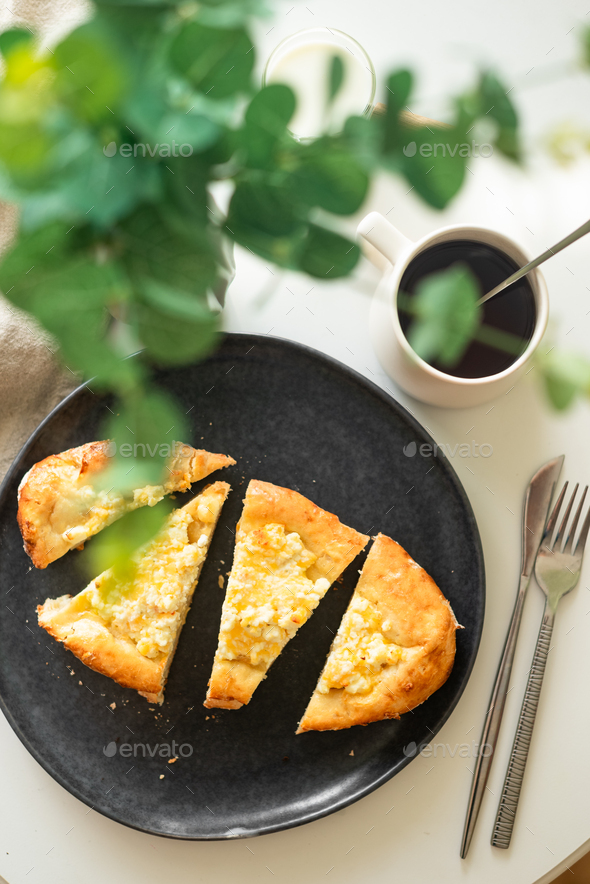 traditional Georgian cuisine. Open pie with mozzarella cheese. Ajara ...