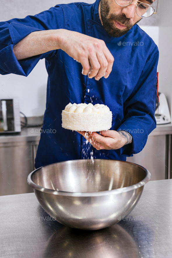 Coco Sprinkles: Close-Up of Pastry Chef's Hands Topping a Coconut Cake ...