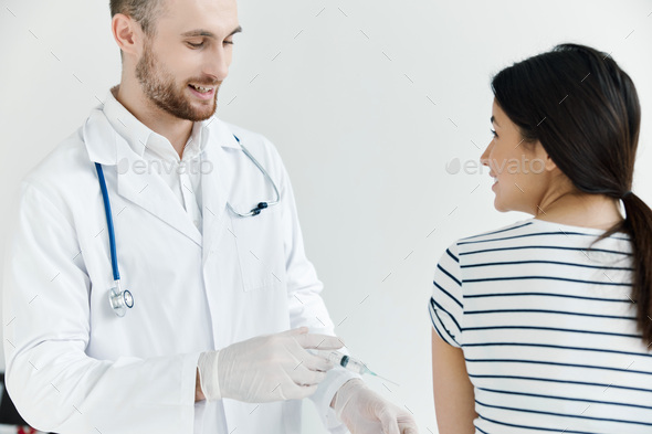doctor injections into patient's arm health treatment covid Stock Photo ...