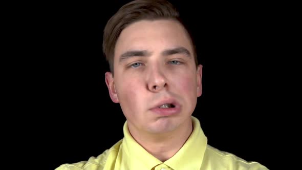 The Young Man Actively Shakes His Head. A Man Twirls His Head and His ...