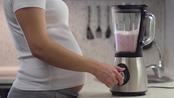Pregnant Women Preparing a Milkshake Using a Brand in the Kitchen ...