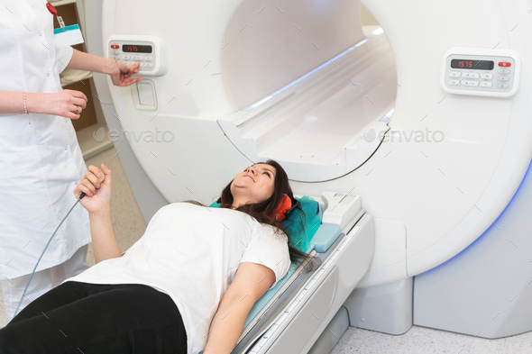 Female patient undergoing MRI - Magnetic resonance imaging in Hospital ...