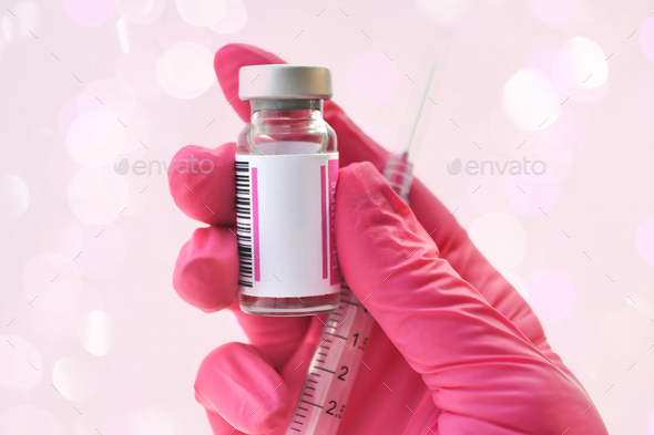 Pink generic vaccine or injection treatment in vial with blank label ...