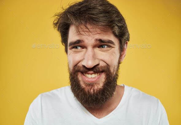 Emotional man with thick beard grinning model yellow background Stock ...