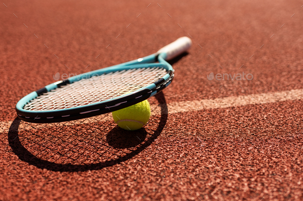 Play tennis. Close-up of tennis racket and tennis ball laying on the ...