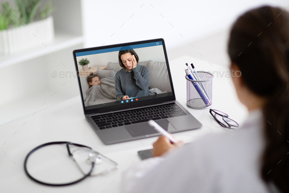 Back view woman doctor have video call with family patients Stock Photo ...