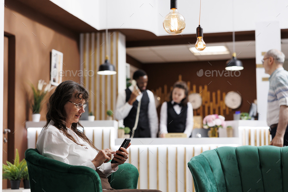 Senior clients check-in at hotel lobby Stock Photo by DC_Studio | PhotoDune