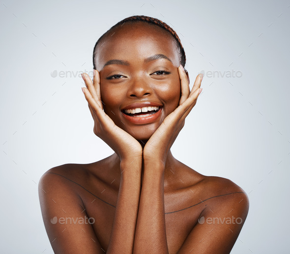 Portrait, beauty and hands on the cheek of a black woman in studio on a ...