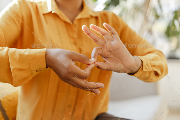 Cropped view of the deaf sign language teacher communicating by hands ...